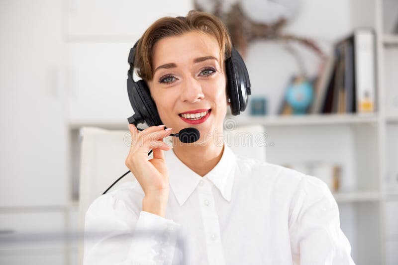 Office Worker Woman is Working at a Computer and Talking by Headset ...