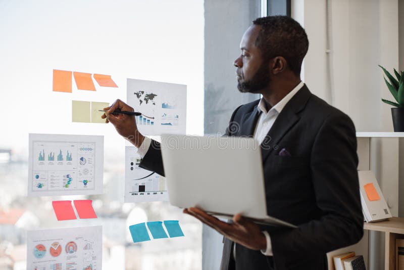 Office Worker Writing Down Notes on Sticker Using Laptop Stock Image ...