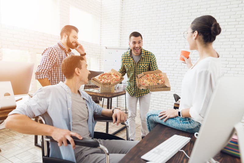 Office Workers and Man in a Wheelchair are Eating Pizza. they Work in a ...