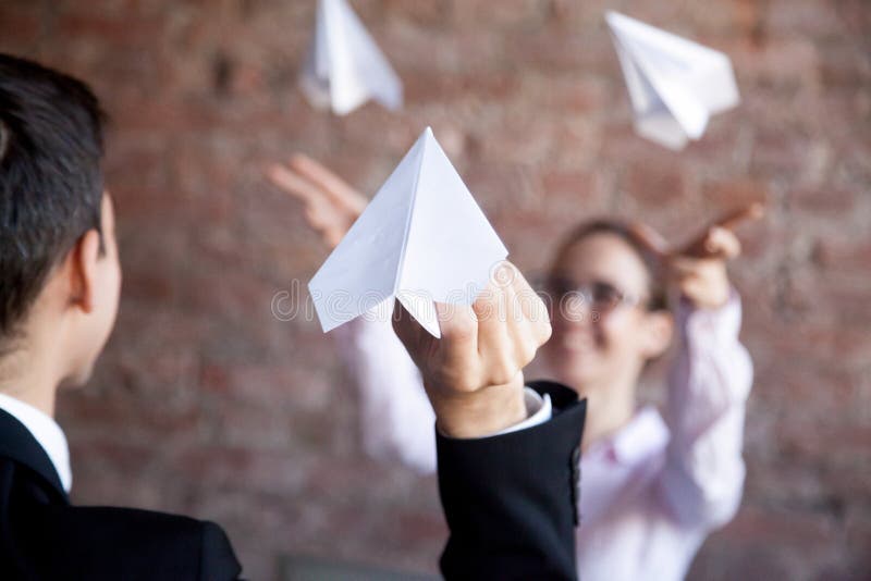 Office Workers Launching Paper Planes Together in Office. Stock Image ...