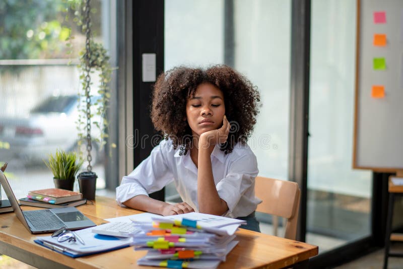 Sitting Work Hard and Look at the Pile of Work with Exhaustion Stock ...