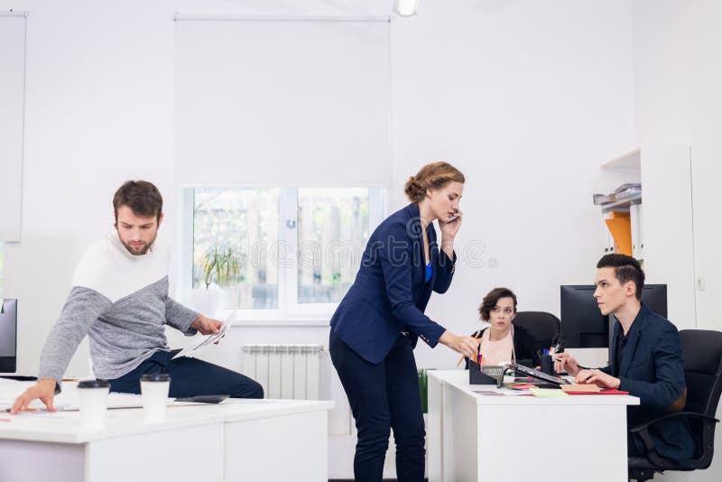 Office Workers in an Open Space, Doing Different Things, Colleagues ...