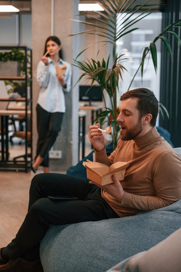 Office Workers are in the Rest Zone is Having a Break and Eating Food ...