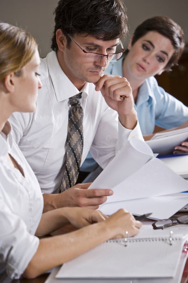 Office Workers Reviewing Reports Stock Image - Image: 15846991 Office Workers Reviewing Reports Stock Image - Image: 15846991