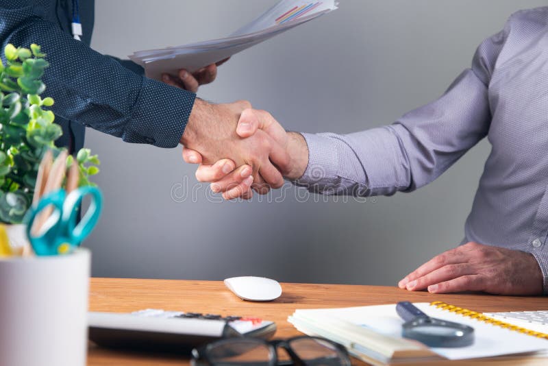 Office Workers Shaking Hands at the Desktop Stock Photo - Image of ...
