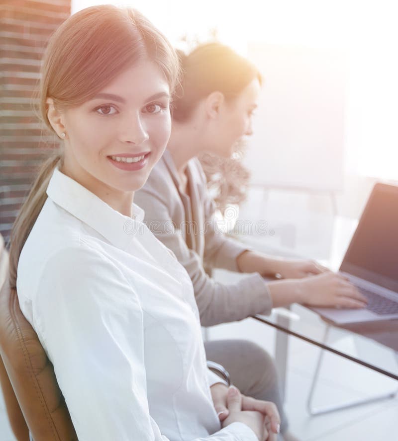 Office Workers Sitting Behind a Desk. Stock Image - Image of assistant ...