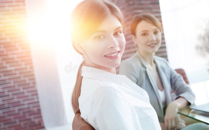 Office Workers Sitting Behind a Desk. Stock Photo - Image of ...