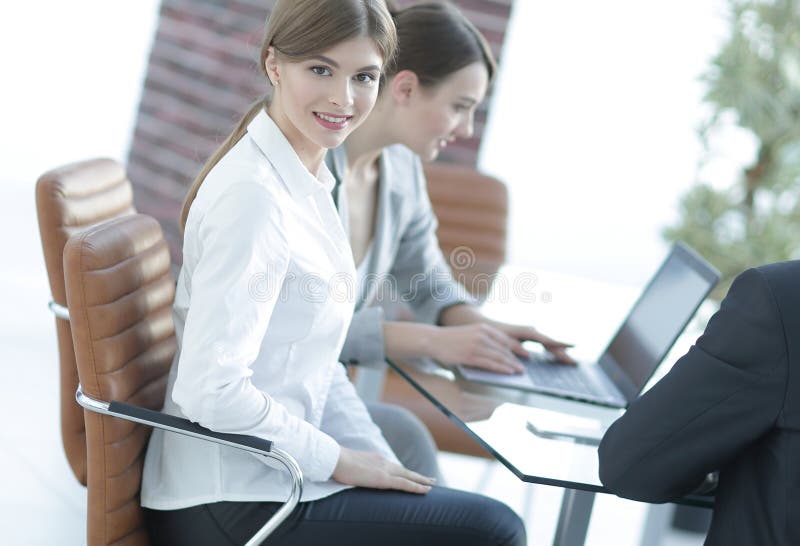 Office Workers Sitting Behind a Desk. Stock Photo - Image of modern ...
