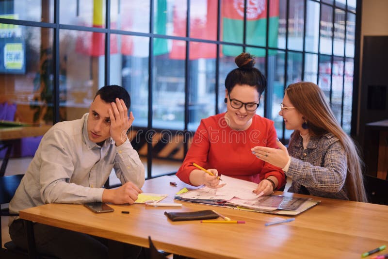 Office Workers, Sitting at Documents, the Girls are Working, the Guy is ...