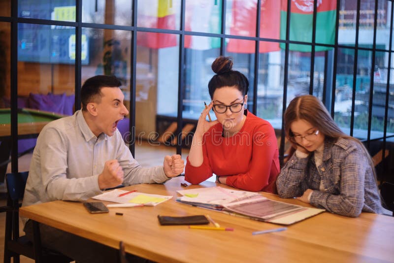 Office Workers, Sitting at Documents, the Girls are Working, the Guy is ...