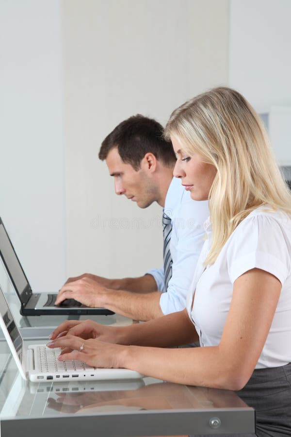 Office Workers Sitting at Their Desk Stock Photo - Image of people ...
