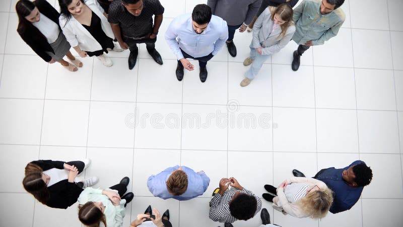 Office Workers Stand and Talk in the Office Lobby.Top View. Stock Photo ...