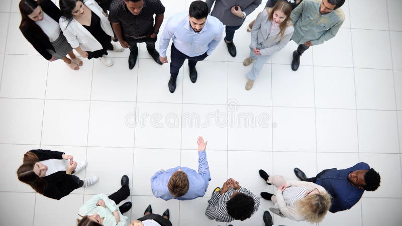 Office Workers Stand and Talk in the Office Lobby.Top View. Stock Photo ...
