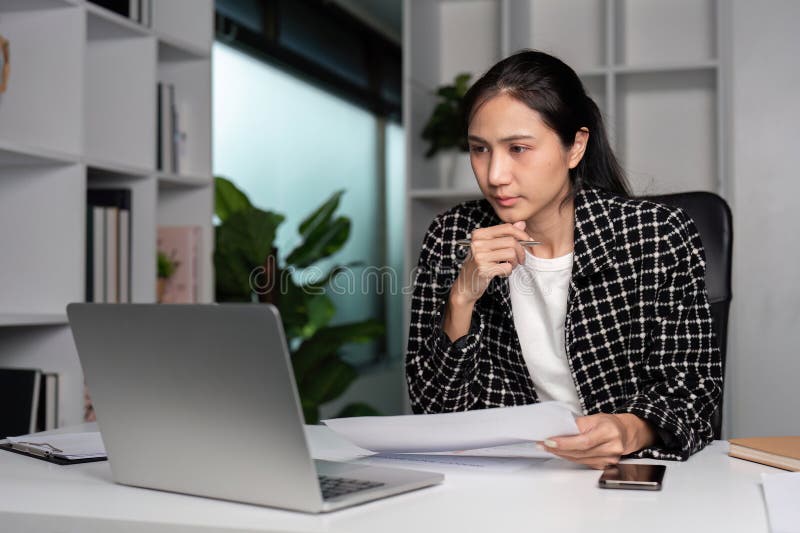 Office Workers Leaving Work Late in a Modern Corporate Environment with ...