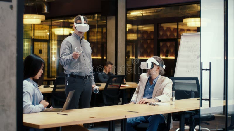 Office Workers Testing VR Headset Together Stock Photo - Image of ...