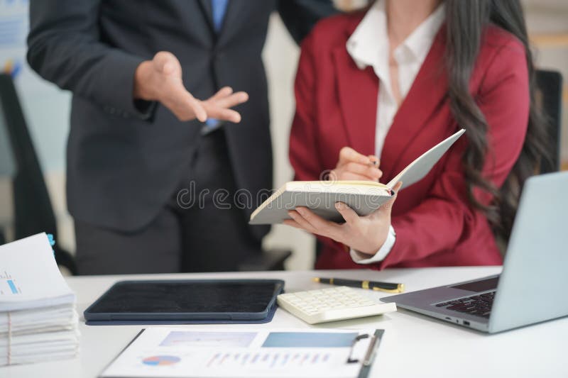 Office Workers Work Together at Desks with Laptop Computers and Digital ...