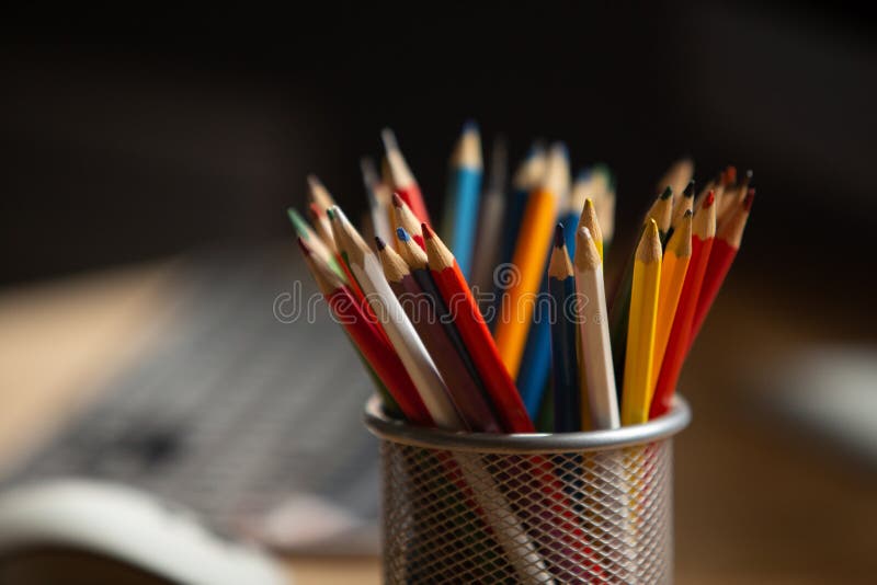 Office Workplace. Focus on Multi-colored Pencils in Foreground at ...