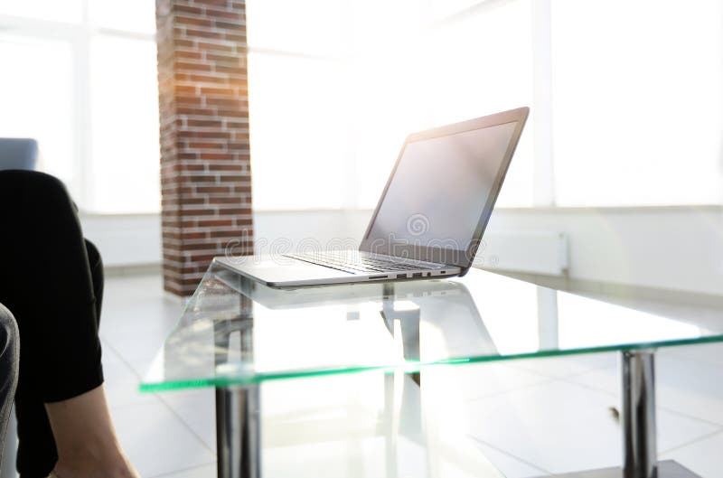 Office Workplace with Laptop on a Glass Table in a Modern Office Stock ...