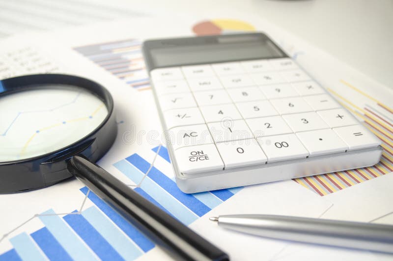 Office Workplace Table with Charts, Glasses and Calculator Stock Image ...