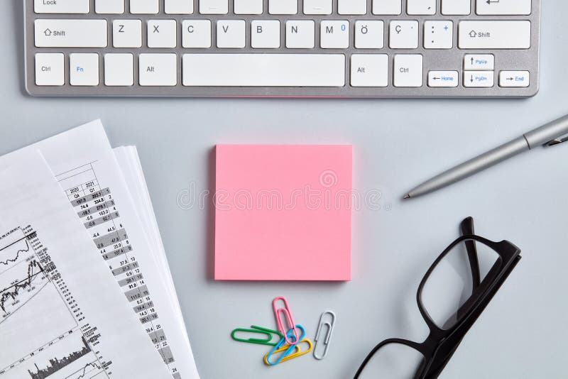 Office Workspace Desktop with a Blank Pink Note Paper in the Middle ...