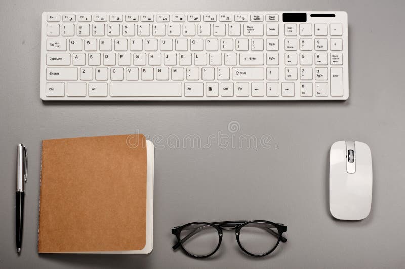 Office Workstation with a Keyboard, Notebook, Pen and Glasses Stock ...