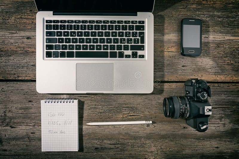 Office Workstation with Laptop, Smartphone, Camera, Notebook and Stock ...