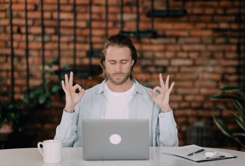 Office Zen. Relaxed Young Man Meditating Sitting at Laptop Computer at ...