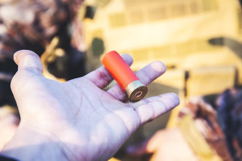 The officer hand bullets stock image. Image of bullet - 170214793