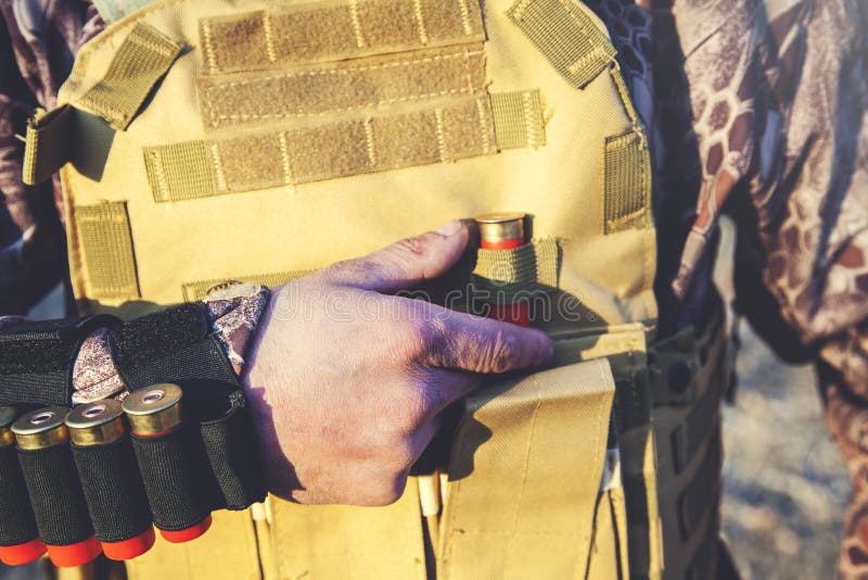 The officer hand bullets stock photo. Image of ammo - 170214874