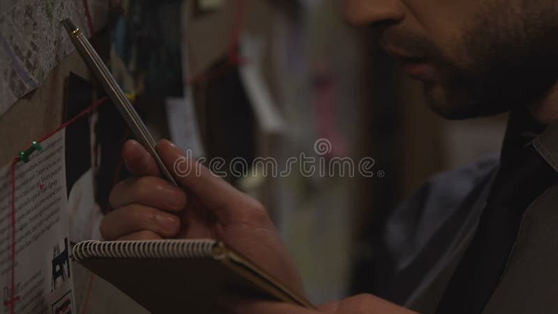 Officer Looking at City Map and Making Notes, Defining Possible Crime ...