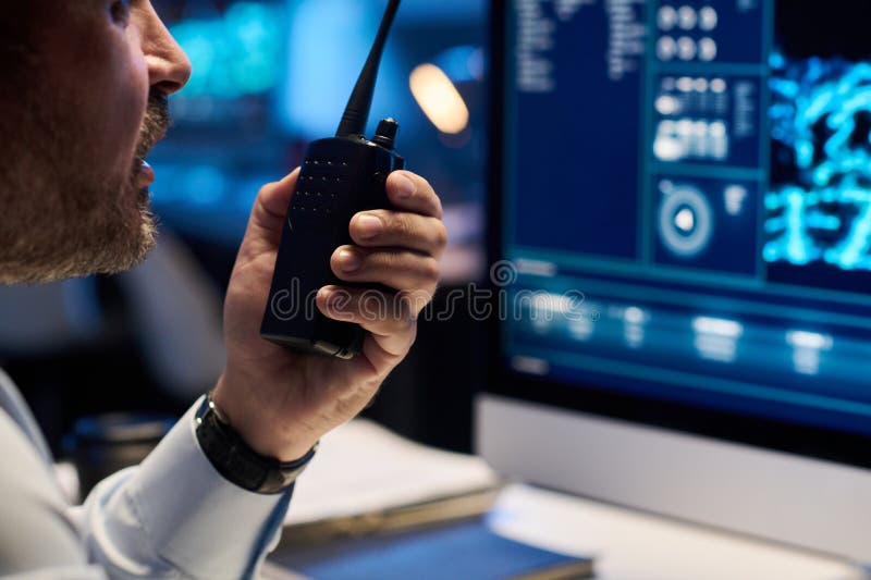 Officer with Portable Radio Transmitter Stock Photo - Image of office ...