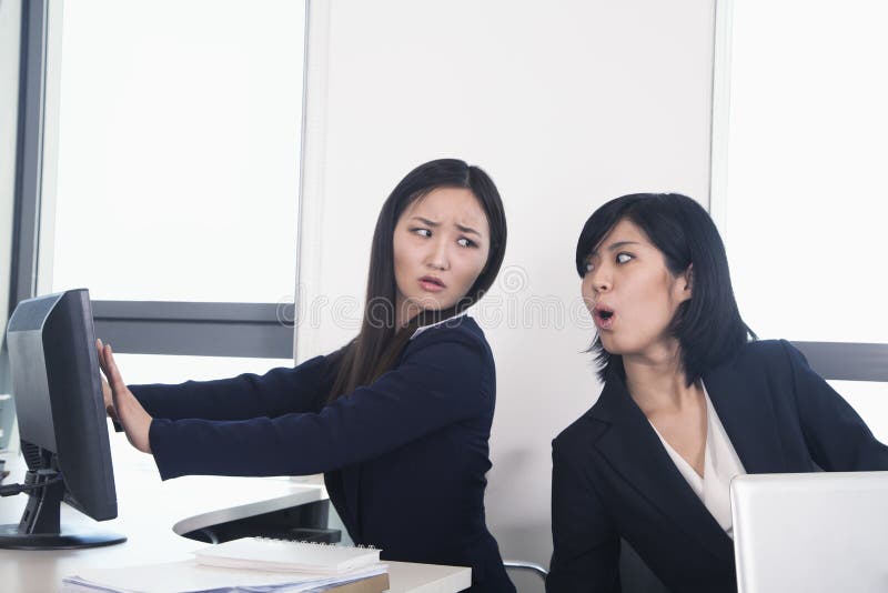 Officer Worker Hiding Her Computer from Coworker Stock Image - Image of ...