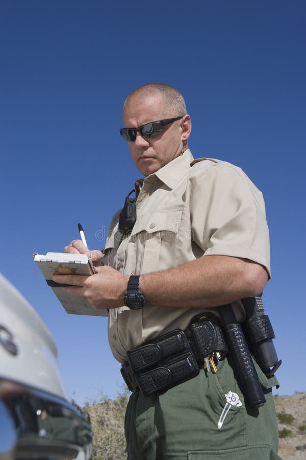 Officer Writing Ticket stock photo. Image of angle, standing - 29651404