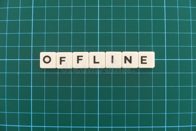 OFFLINE - Word on a Blue Piece of Paper on the Background of a Stack of ...