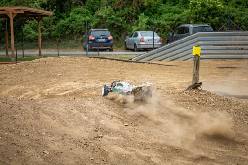Yellow Electric RC Buggy Racing on an Offroad Track Stock Photo - Image ...
