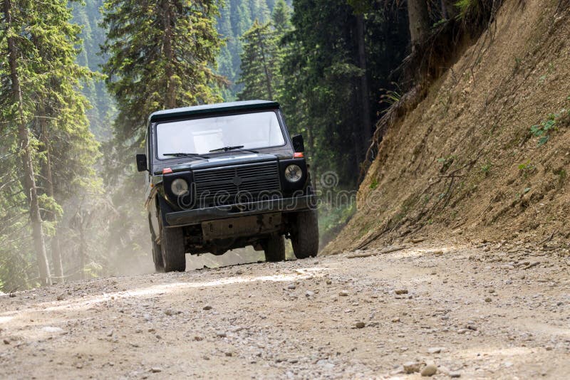 Red Off-road 4x4 Vehicle Climbing Rocks Stock Photo - Image of outdoor ...