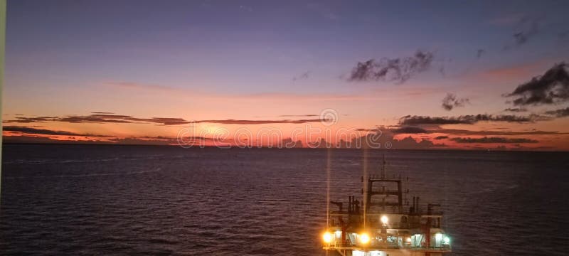 Sunset in Bintuni Gulf stock image. Image of setting - 133374181