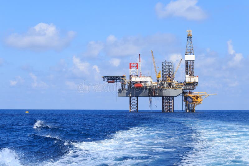 Offshore Jack Up Drilling Rig Over the Production Platform Stock Photo ...