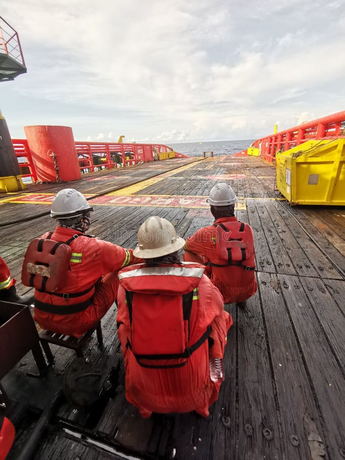 Offshore Marine Crew Working on Deck during Sunny Day Stock Image ...