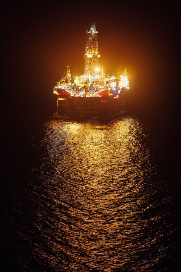 Offshore Oil Platform and Gas Drillship with Illumination Stock Image ...