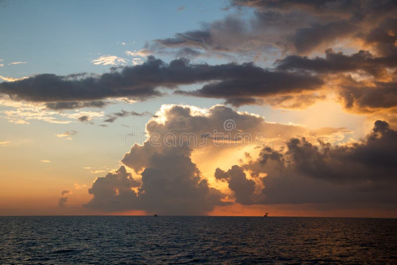 Offshore Oil Rig during Sunset Stock Photo - Image of land, machinery ...