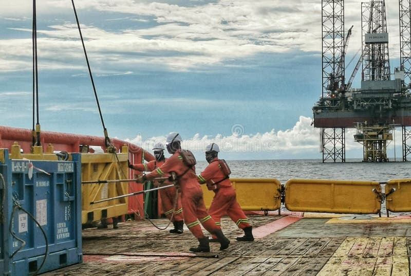 Offshore Support Vessel Deliver Cargo To Oil Platform at Sea Editorial ...
