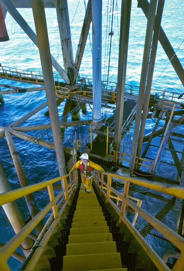 Offshore Worker on the Steps Up from the Sea Deck. Stock Photo - Image ...