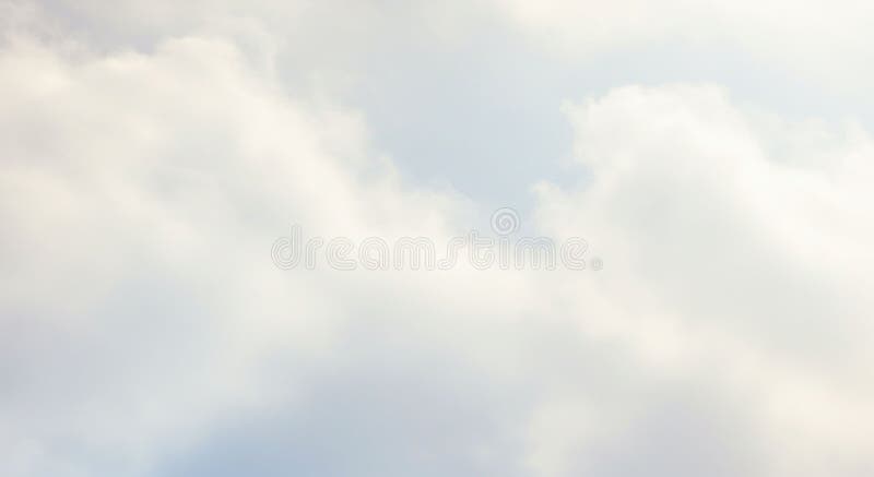 Oft White Clouds Fill the Sky Against a Pale Blue Backdrop. the Clouds ...