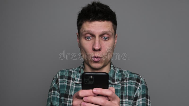 Oh My God, Wow. Young Casual Man in Shock while Using Smartphone Stock ...