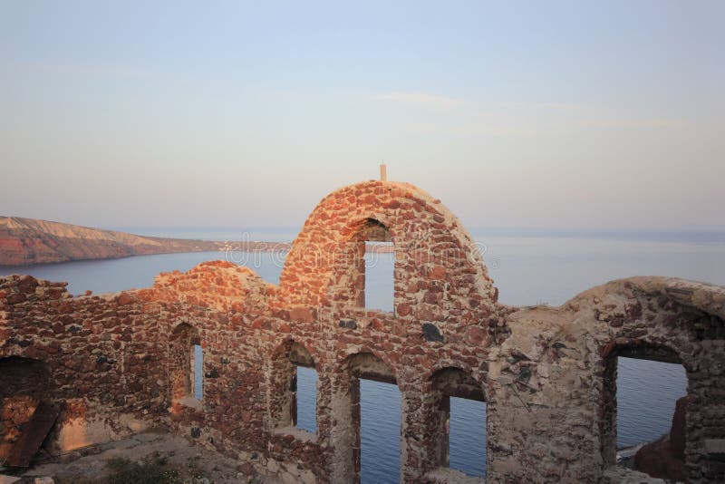 Oia castle at sunrise stock photo. Image of arrow, flag - 24660434