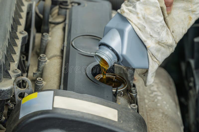 Oil is added to an engine stock image. Image of engine - 335519011