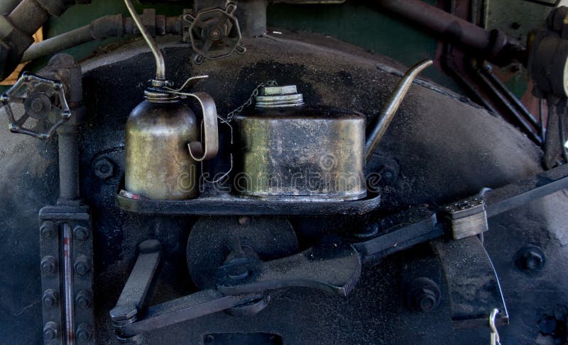 Oil cans and train engine stock image. Image of background - 34913135