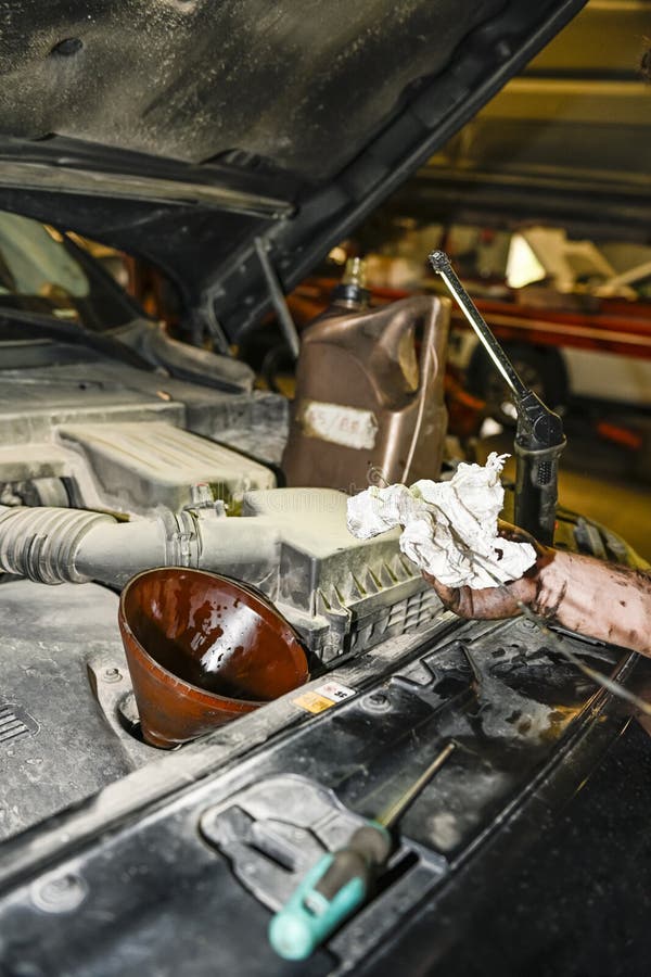 Oil change of a car engine stock image. Image of people - 250619687