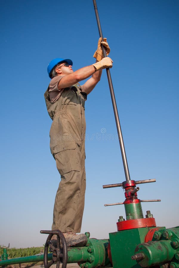 Oil Company Worker on the Well Stock Image - Image of controls, fossil ...
